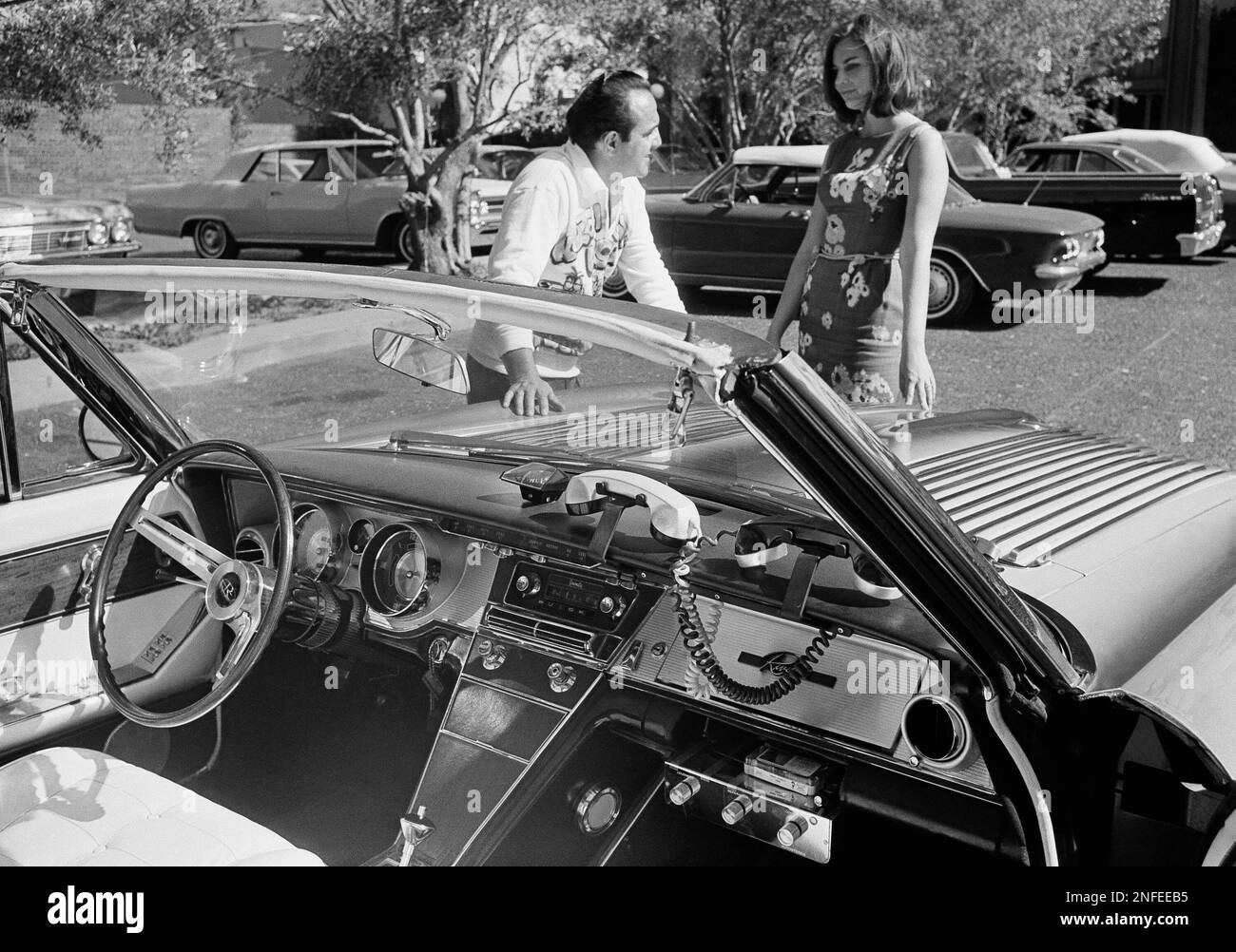 George Baris, left, poses with model Sandy Braddock, in Los Angeles ...