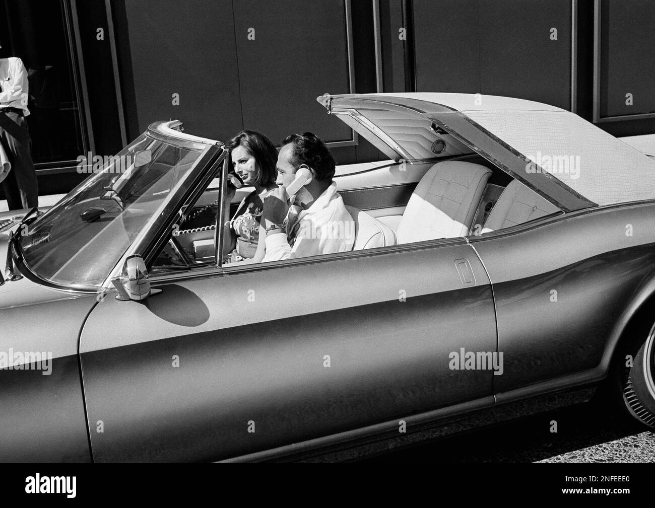George Baris, right, and model Sandy Braddock, sit inside a Buick ...