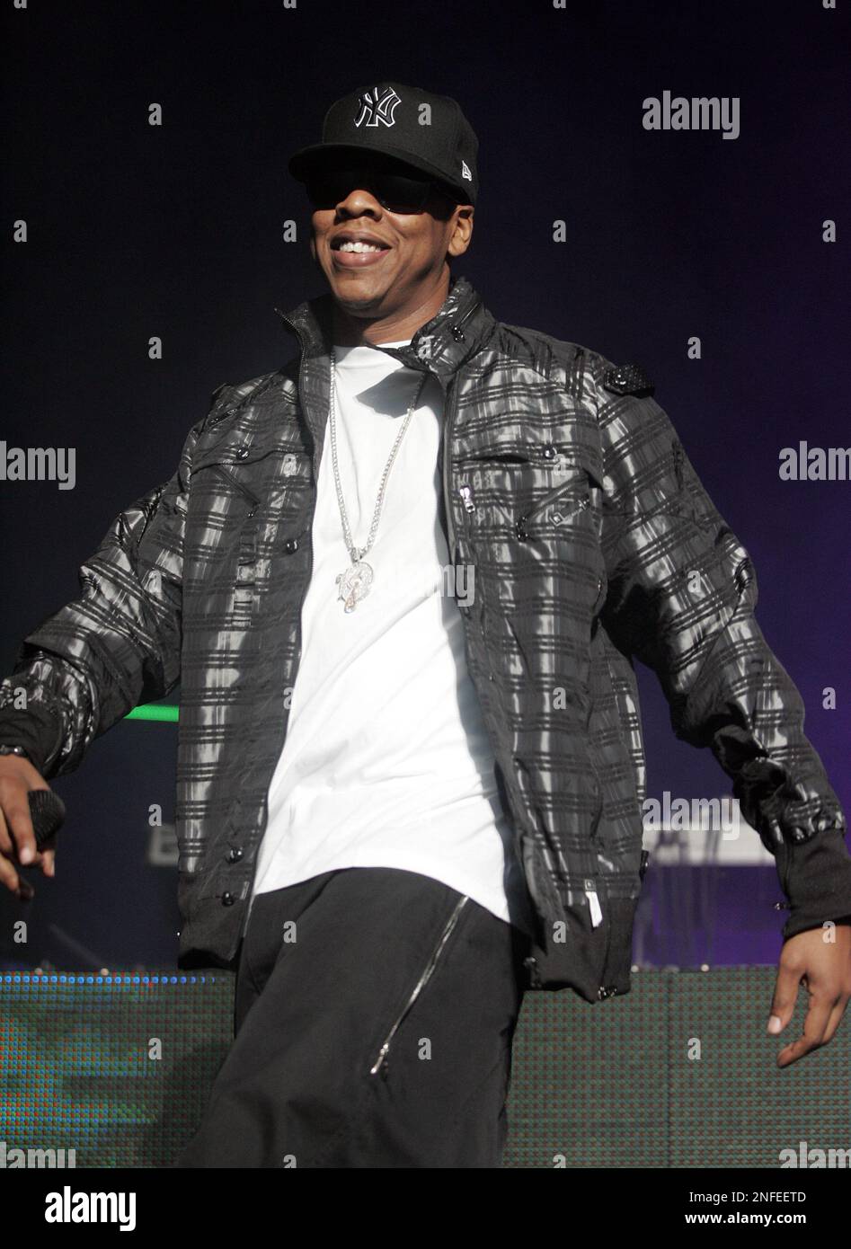 Recording artist Jay-Z, sings for fans at Cobo Arena during an ...