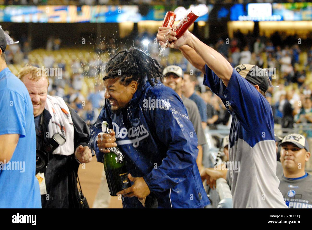 Los Angeles Dodgers' Manny Ramirez gets sprayed with beer after the ...