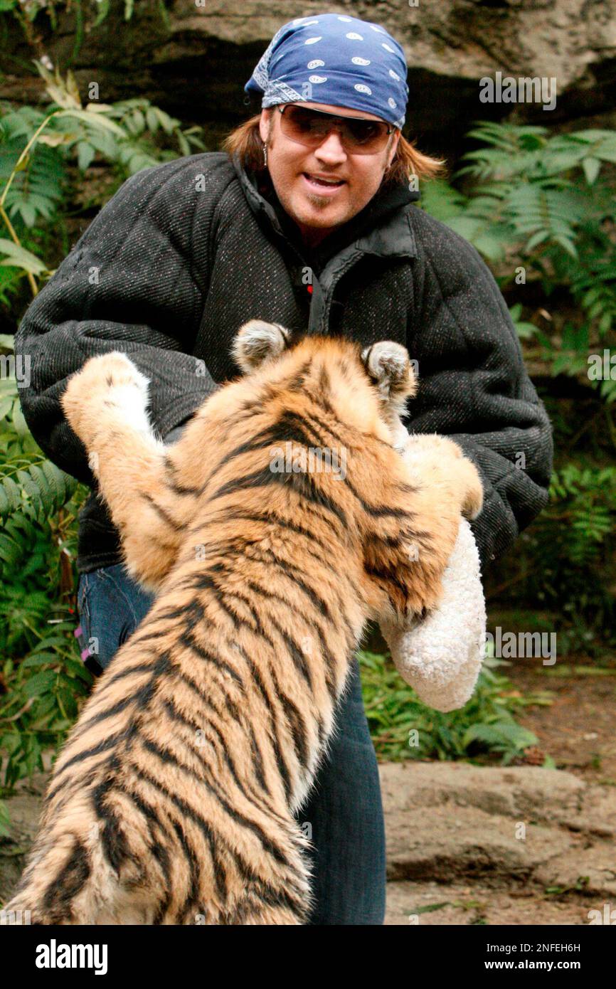 Country Western singer Billy Ray Cyrus plays with his namesake, four ...