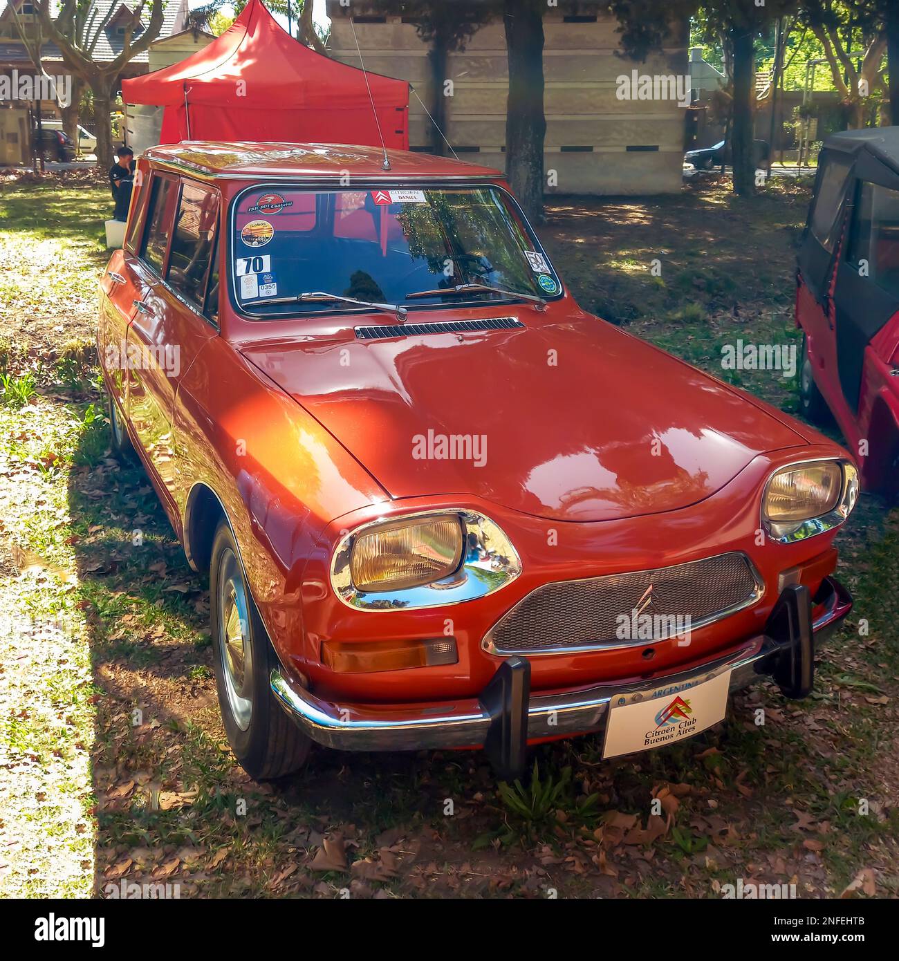 A classic red Citroen Ami 8 displayed at a car show in San Isidro ...