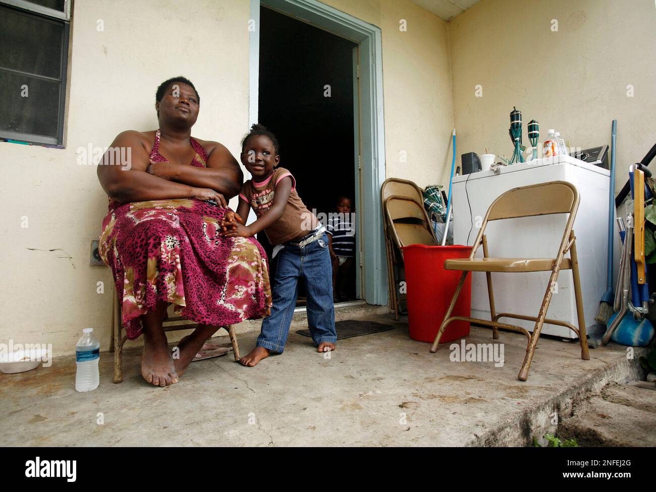 Jackie Griffith talks to her granddaughter, Neshia, as she sits on her ...