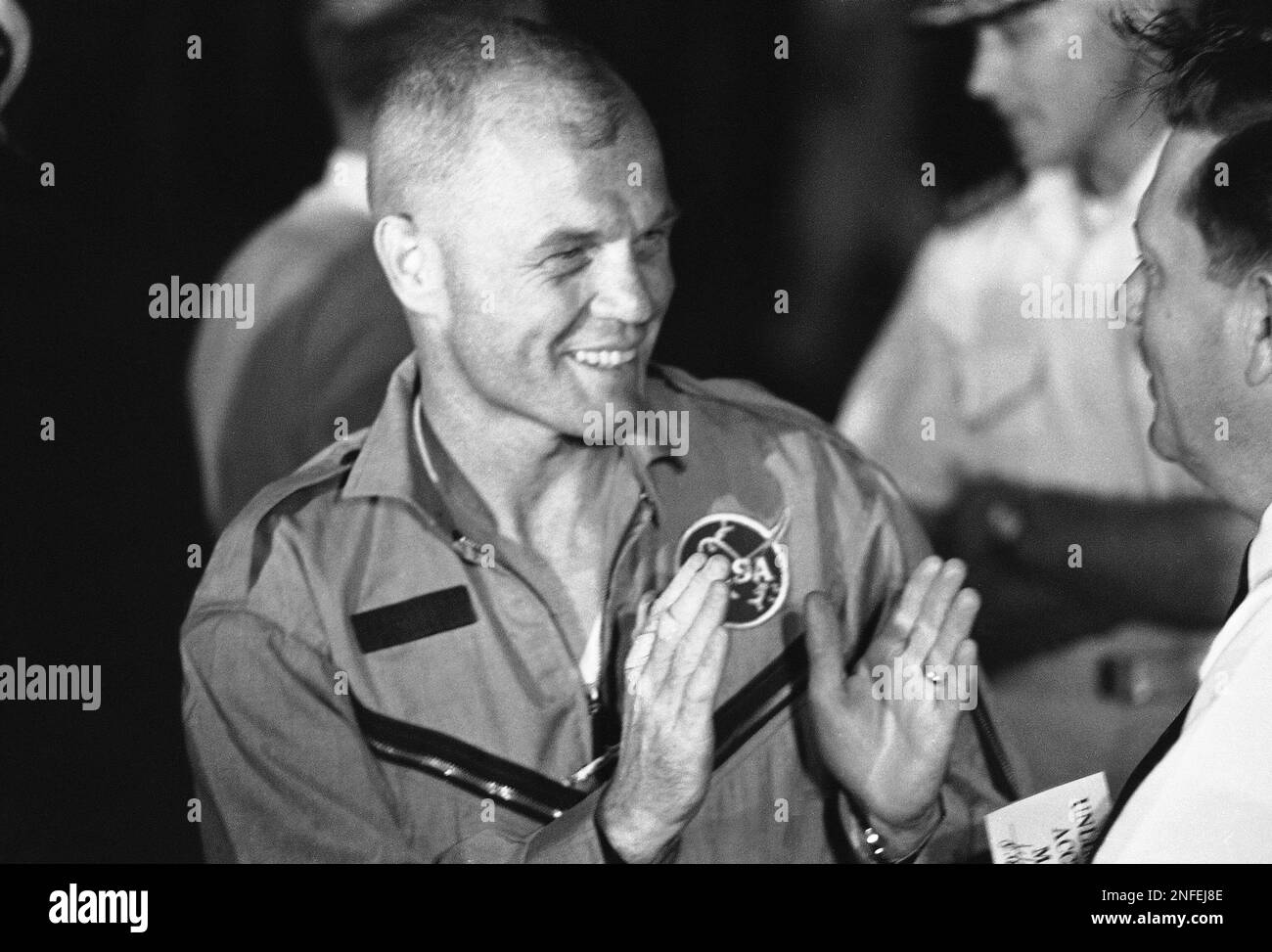 U.S.astronaut John Glenn smiles aboard the USS Randolph soon after his ...