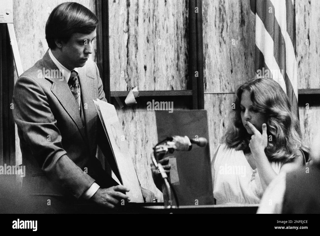 Nita Jane Neary, right, looks at drawing in court while prosecution ...