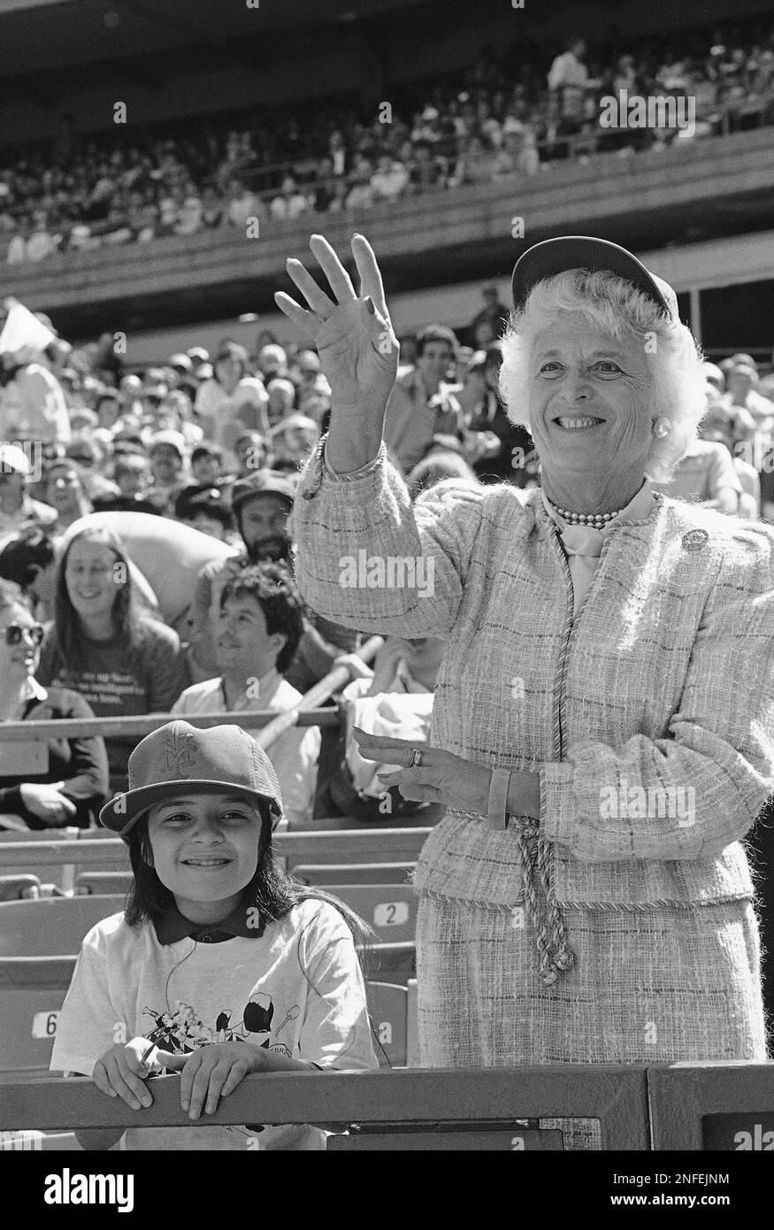Mrs. Barbara Bush, wife of Vice-President George Bush, throws out the ...