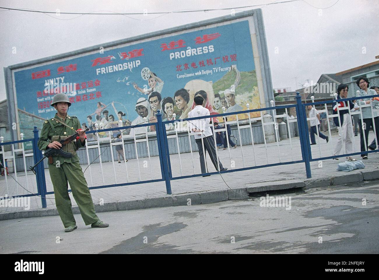 An unidentified Chinese soldier stands guard in front of a propaganda ...