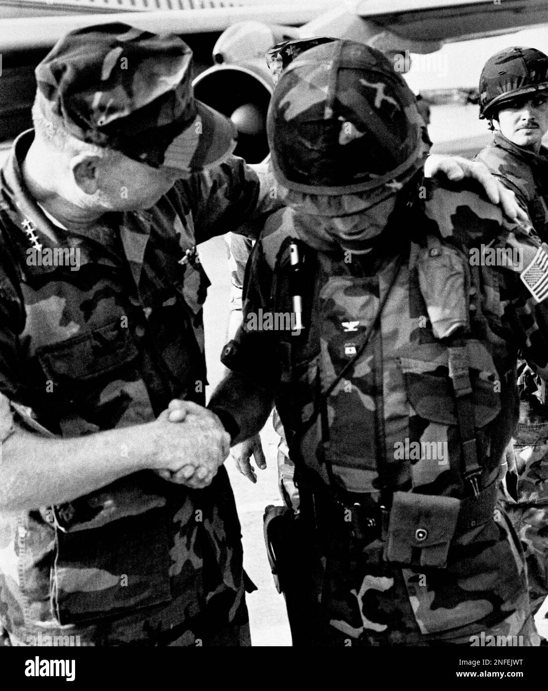 Gen. Paul Kelley, left, Commandant of U.S. Marine Corps, consoles his ...