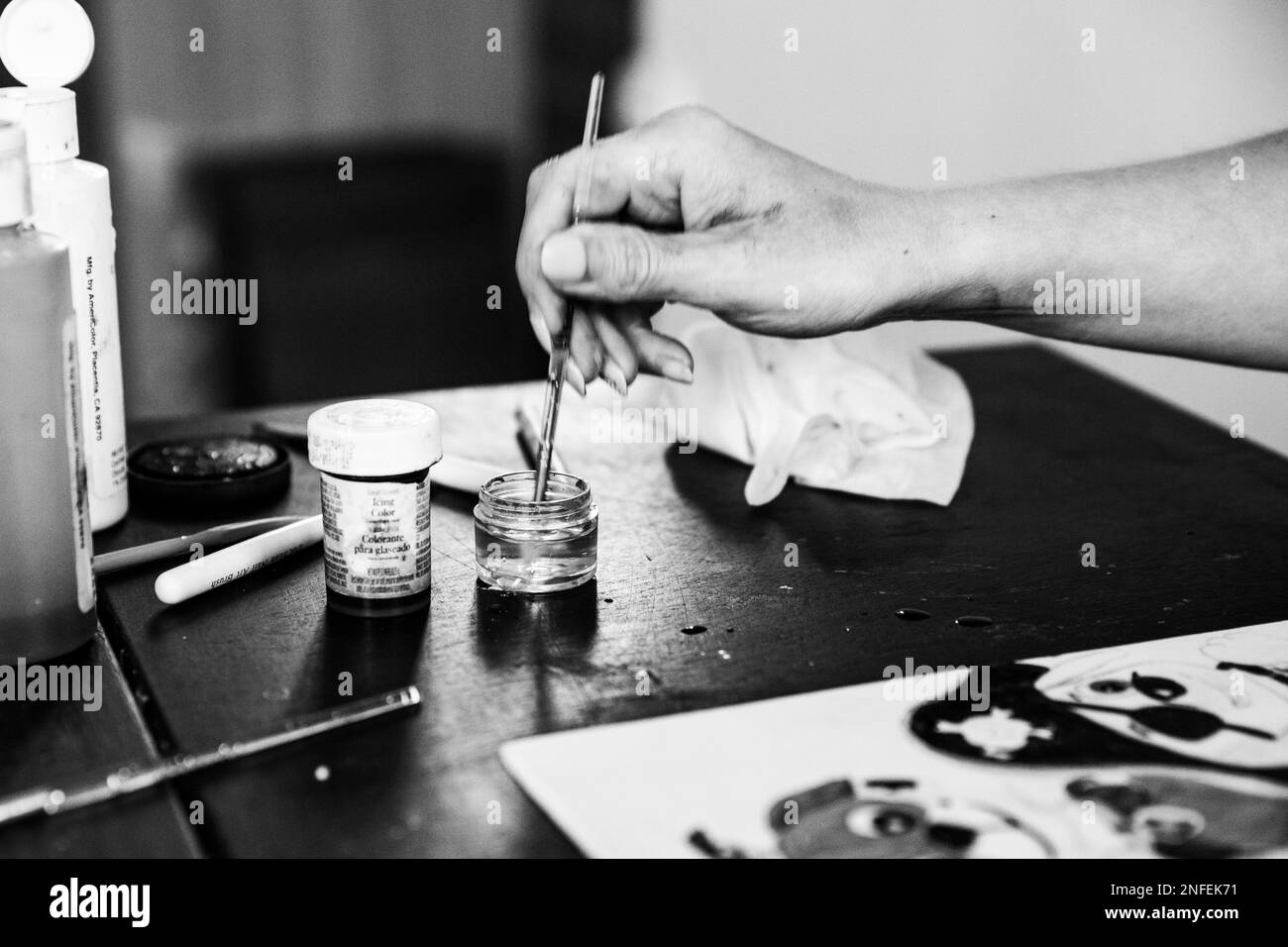 Closeup hand brush paint Black and White Stock Photos & Images - Alamy