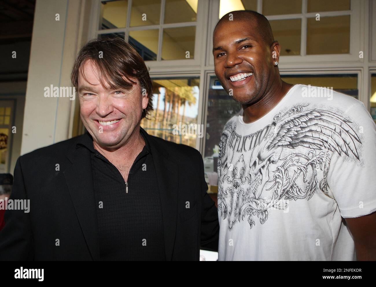 Gene Arnold, left, and athlete Laurent Crawford attend Gene Arnold's ...