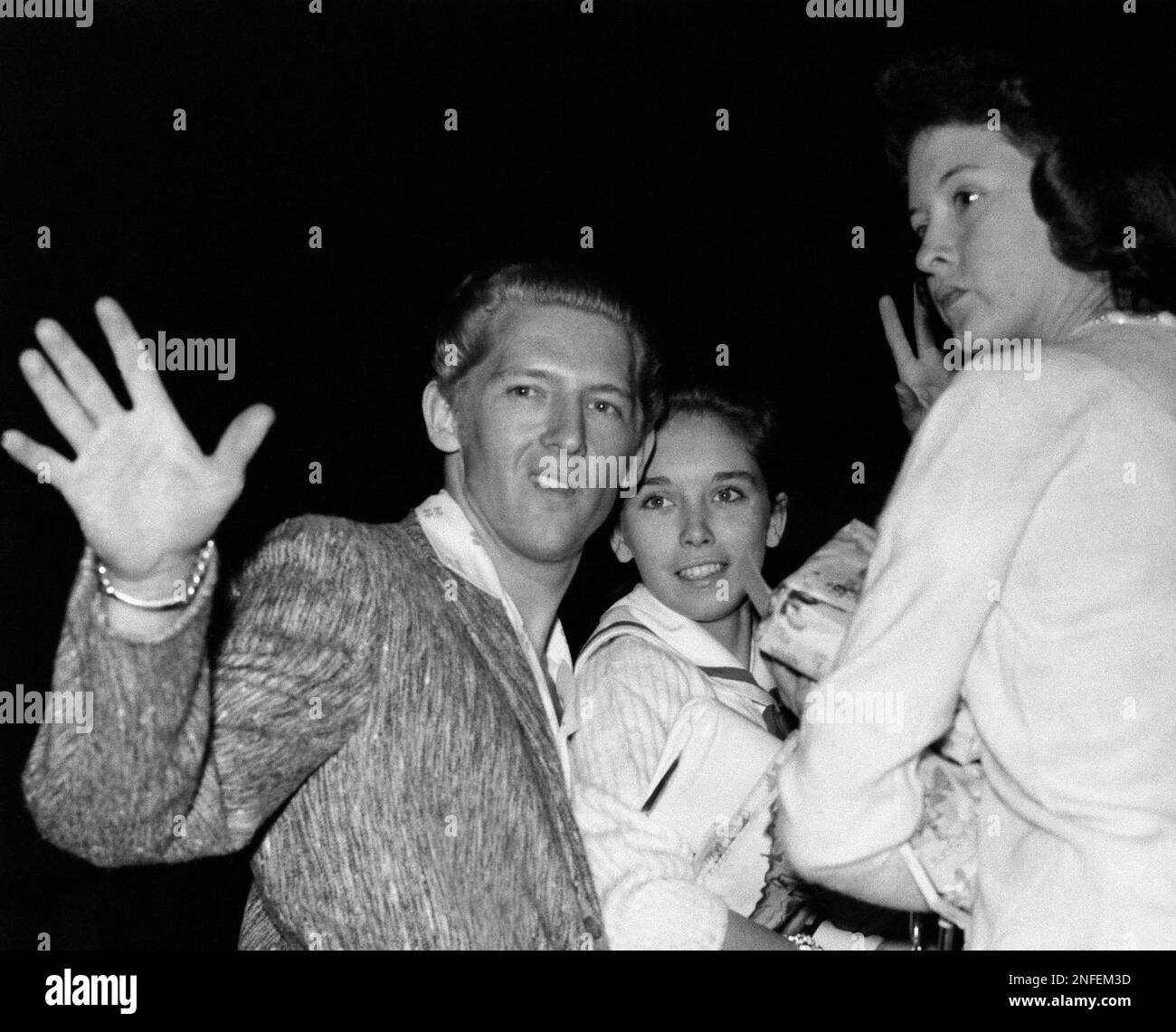 Jerry Lewis, left, waves goodbye with his wife, Myra Lewis and his ...