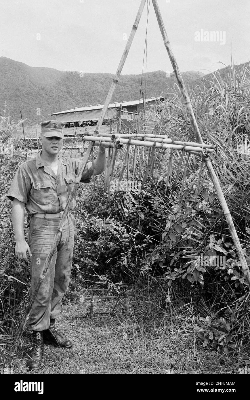 A Marine poses beside a type of booby trap U.S. Marines have to face in ...