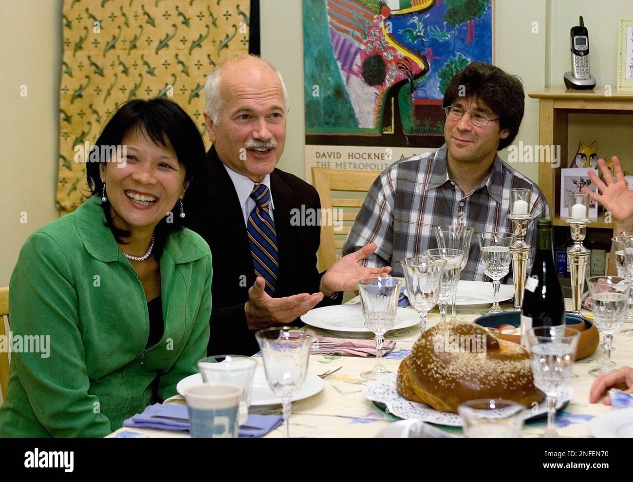 NDP Leader Jack Layton, centre, and his wife Olivia Chow sit at the family table of Michael ...