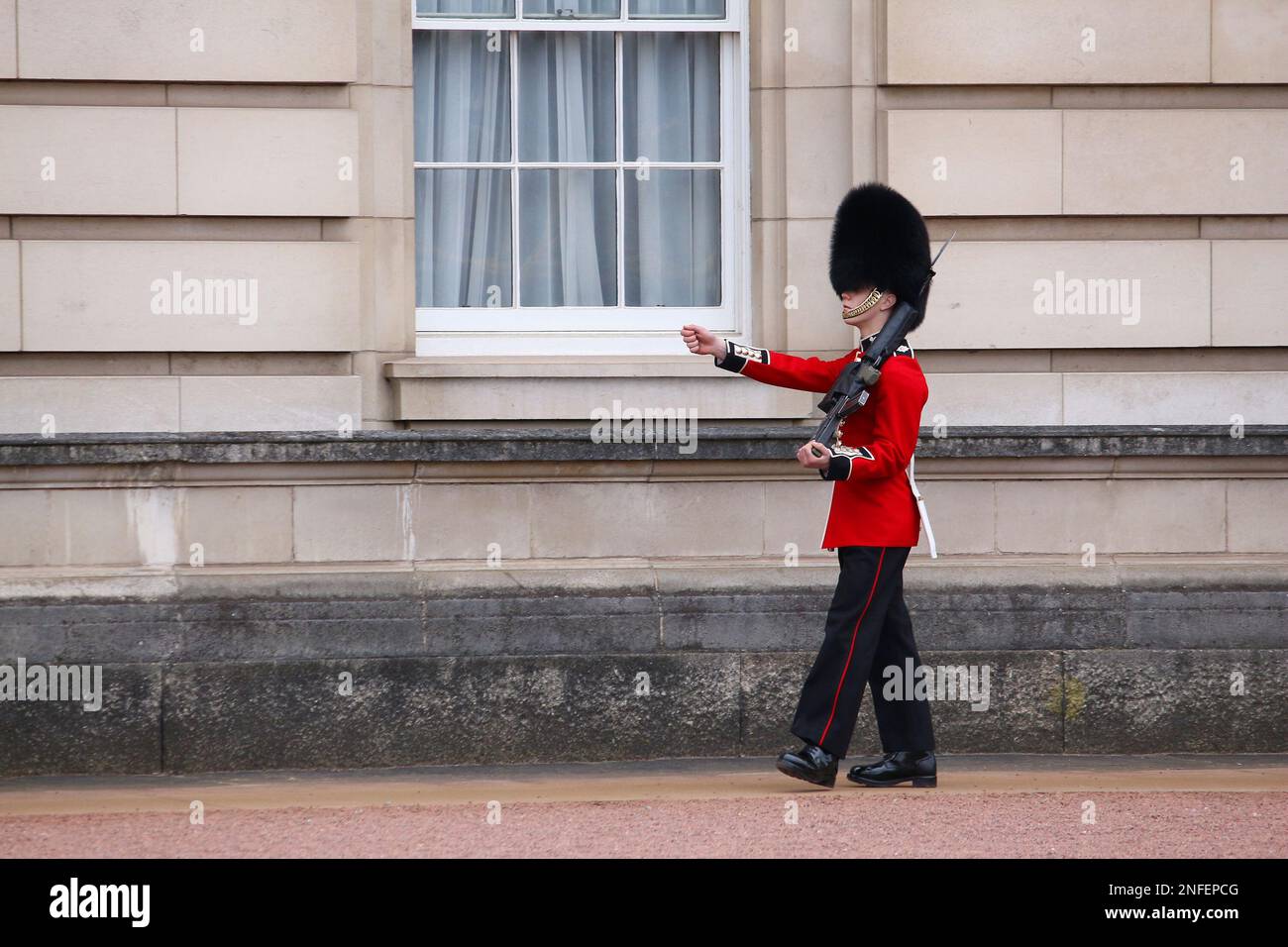LONDON, UK - APRIL 23, 2016: Queen's Guard soldier patrols front of ...