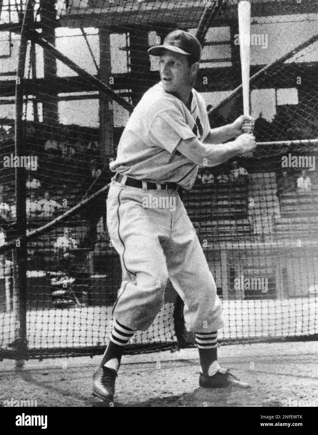 Stan Musial is caught by sequence camera as he takes batting practice ...
