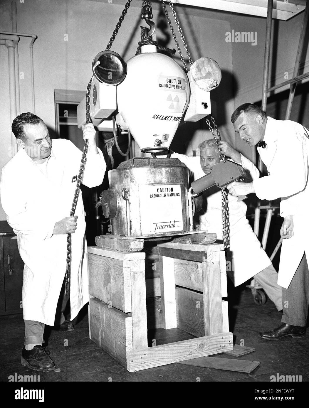 Tracerlab, Inc. engineers and technicians, seen Dec. 31, 1957 in Boston ...