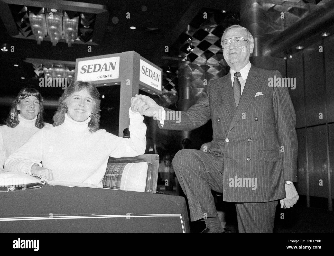 Chrysler Chairman Lee Iacocca gets some help promoting the six ...