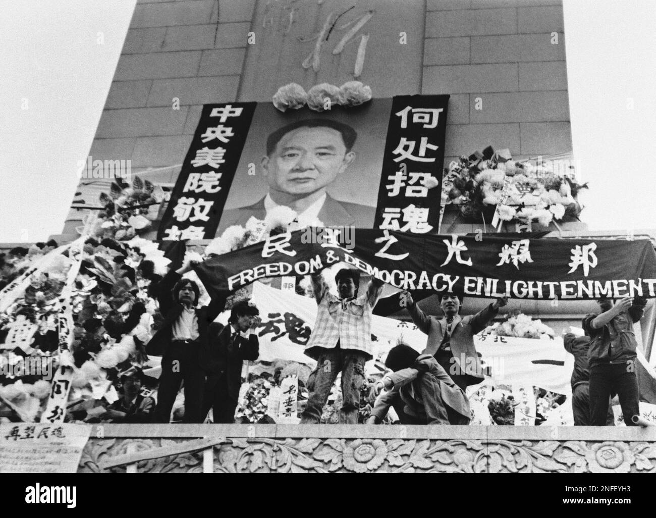 Chinese students hold aloft a banner calling for "Freedom & Democracy ...