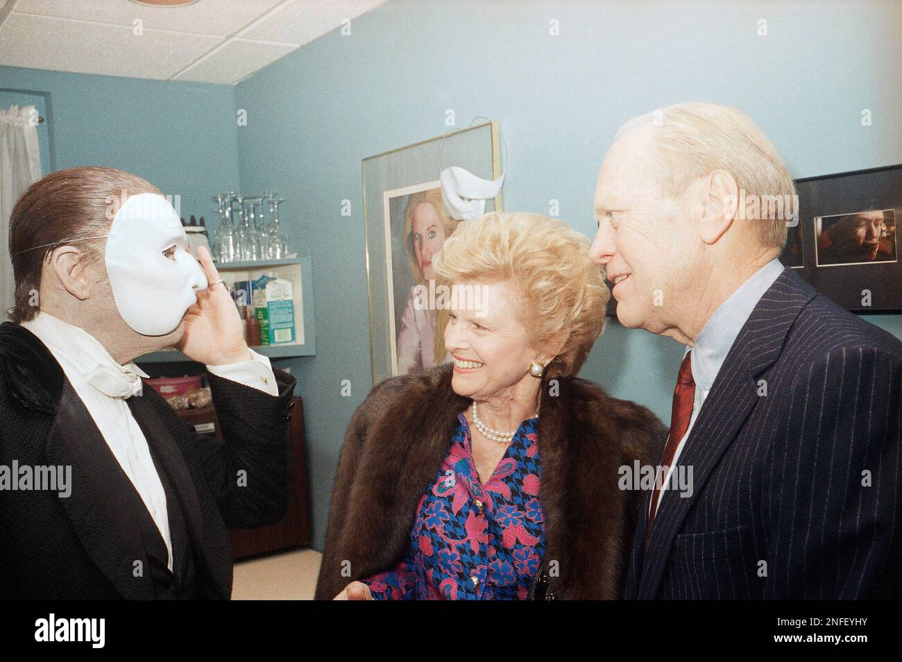 Former President Gerald Ford and his wife Betty peer intently at ...