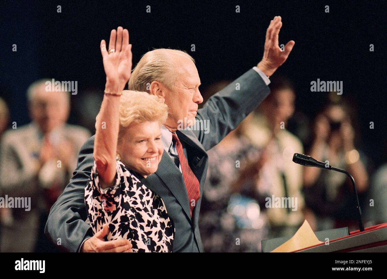 Former President Gerald Ford and his wife Betty wave to the audience at ...