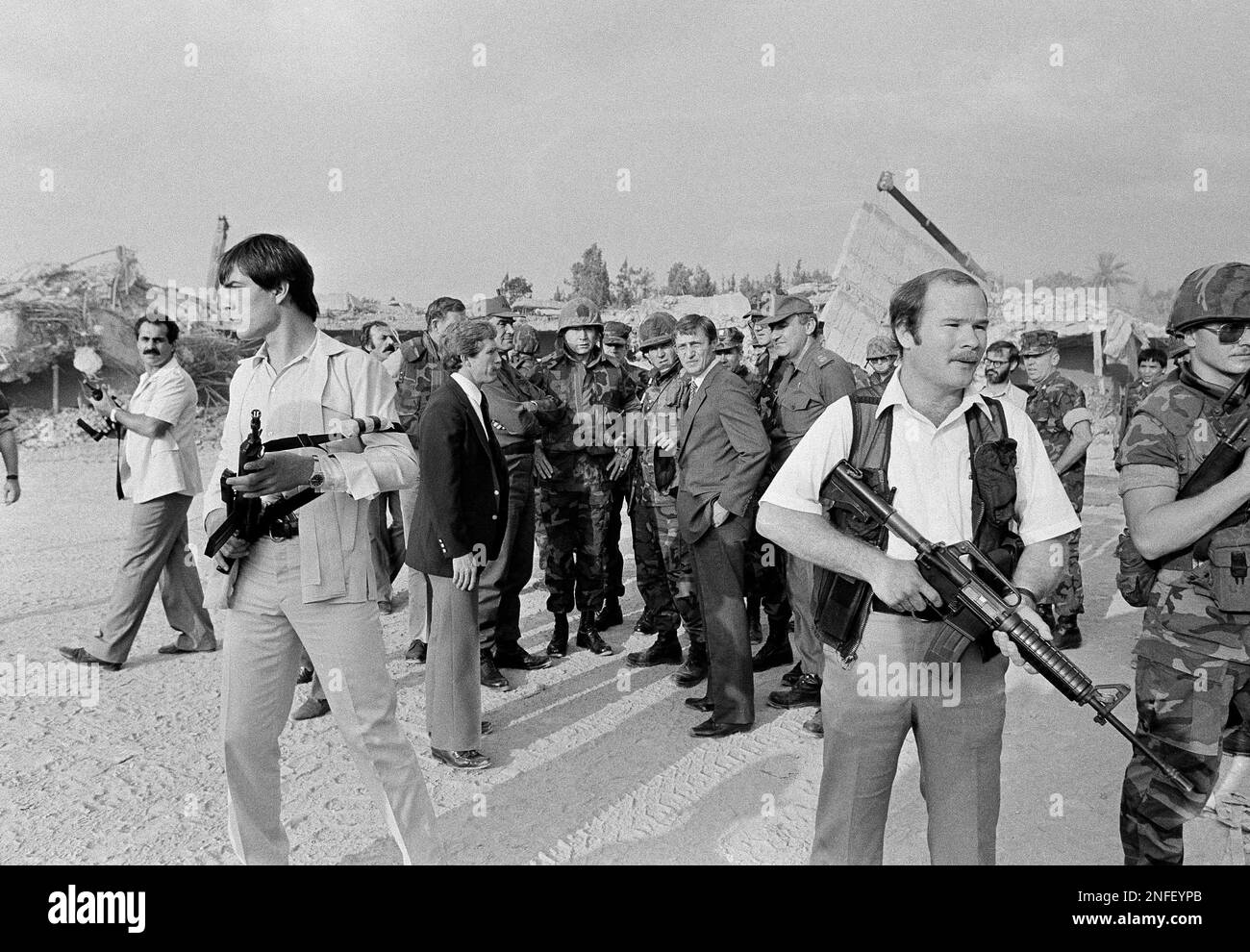 American and Lebanese security men, their weapons at the ready, guard ...