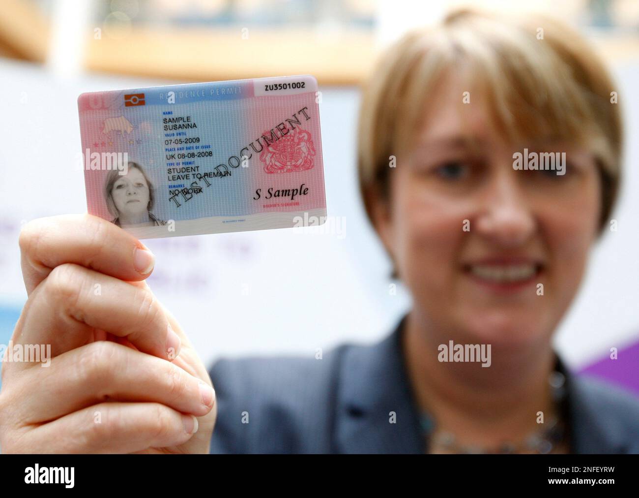 Britain's Home Secretary Jacqui Smith displays a specimen ID card at a ...