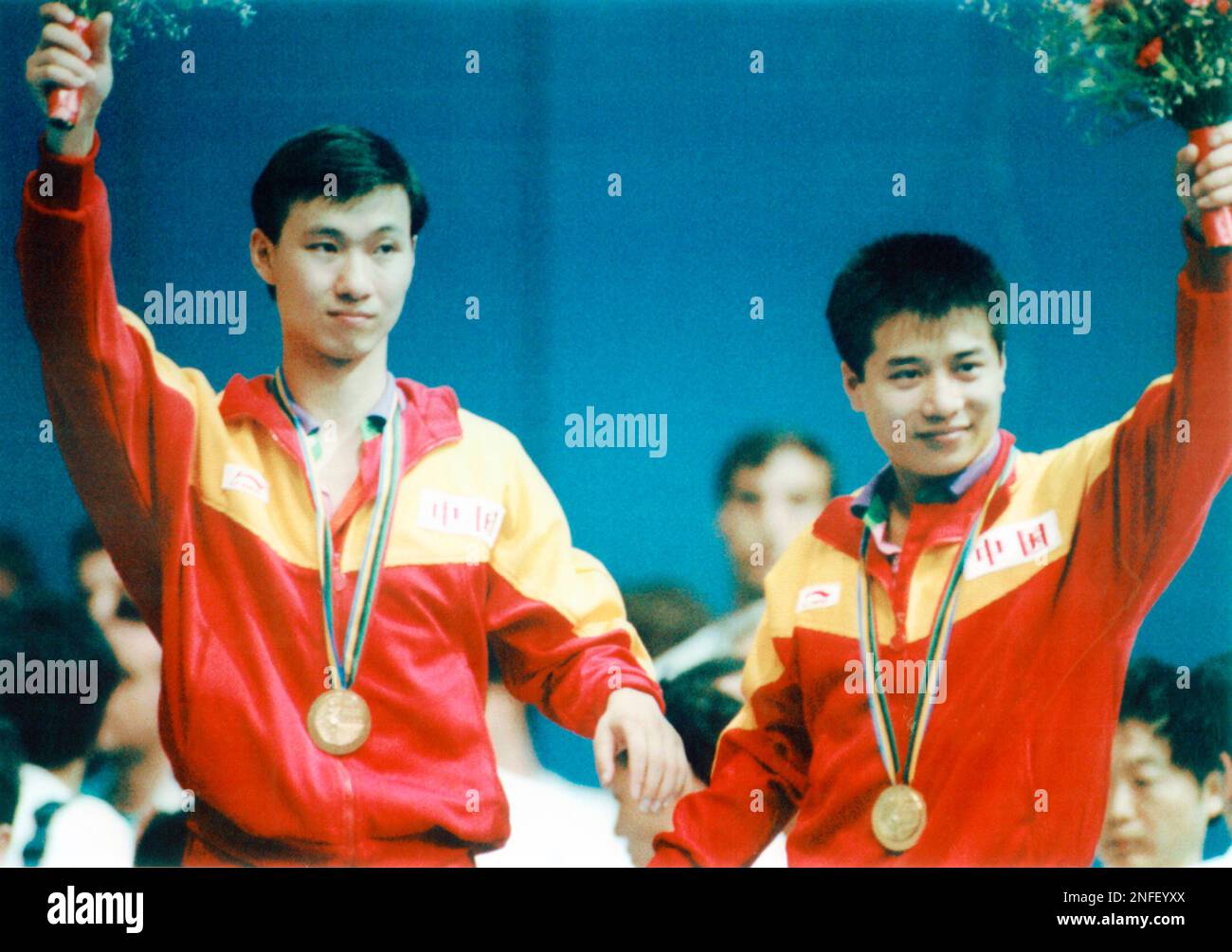 China's Lu Lin, left, and Wang Tao acknowledge the crowd after beating ...