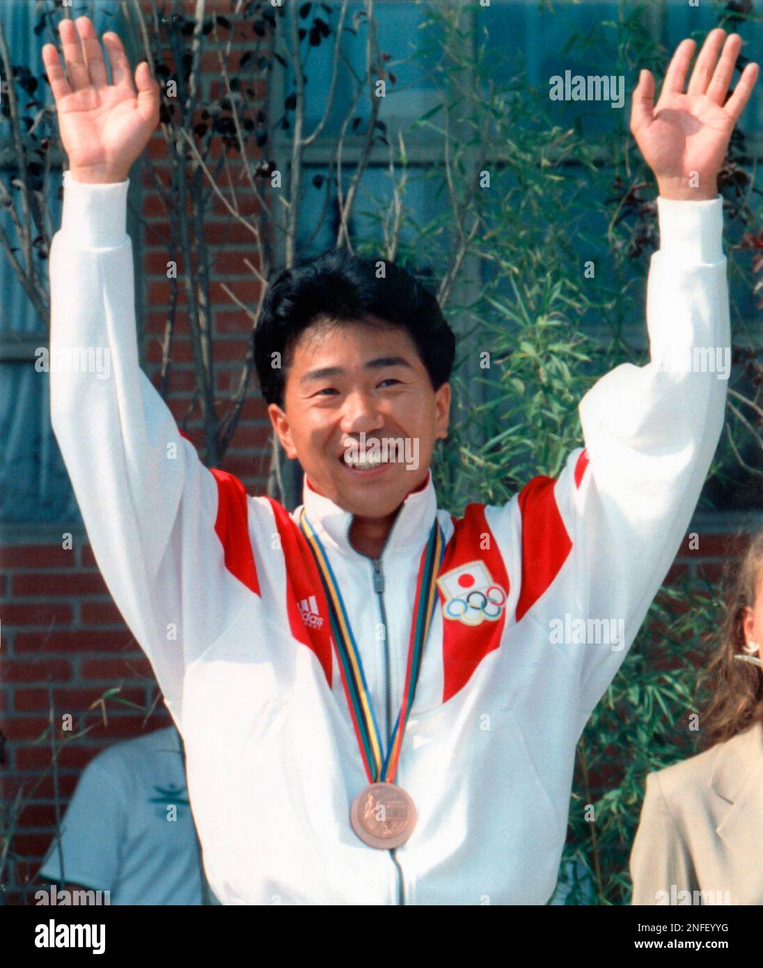 Japan's Ryohei Koba acknowledges the crowd during the medal ceremony ...