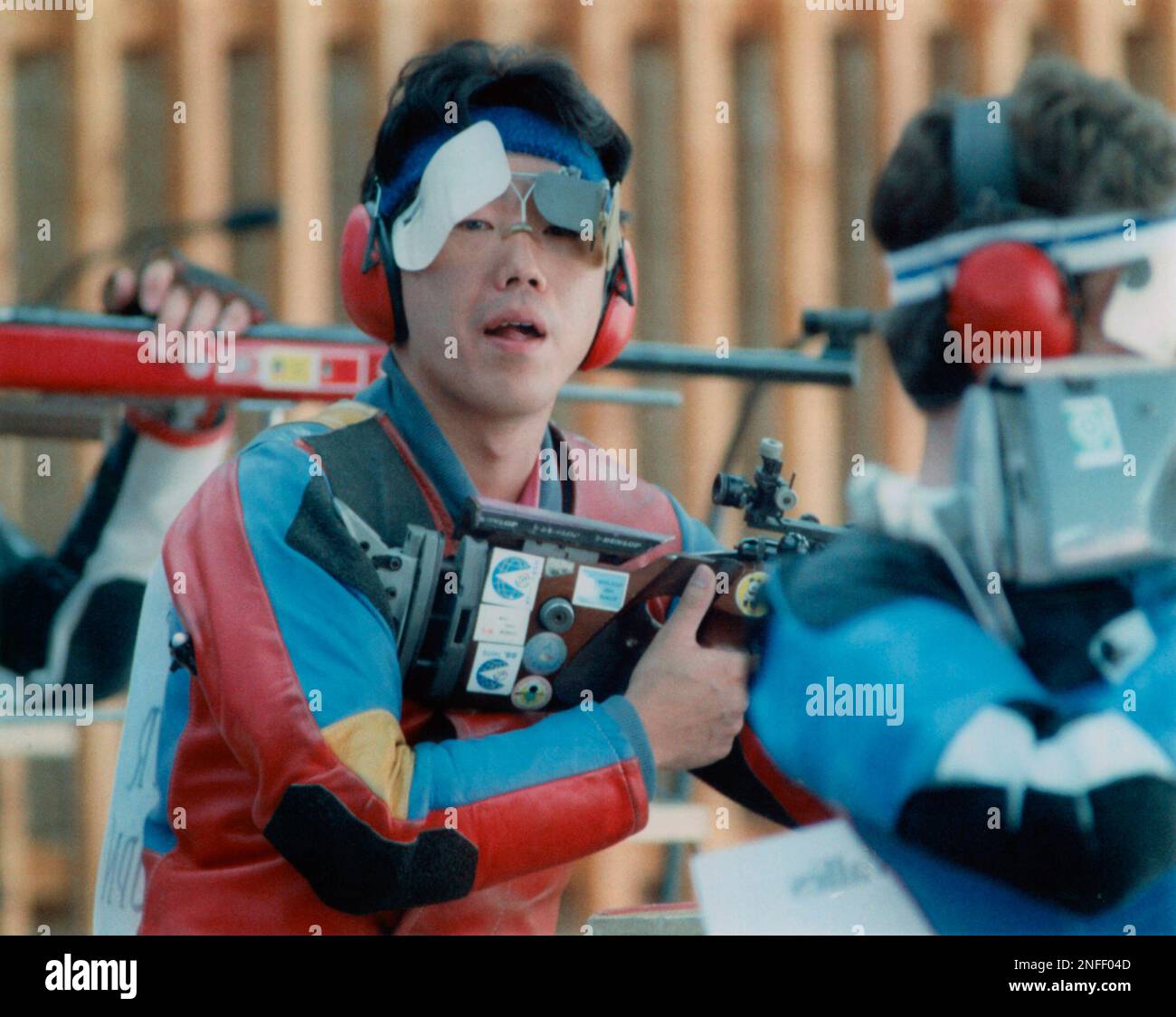 Japanese shooter Ryohei Koba takes a break during Friday's competition ...