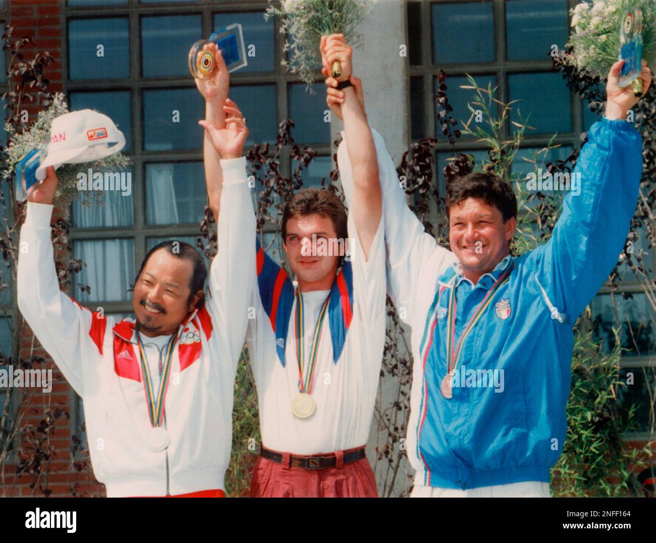 Czechoslovakia's gold medalist Peter Hrdlicka is flanked by silver ...