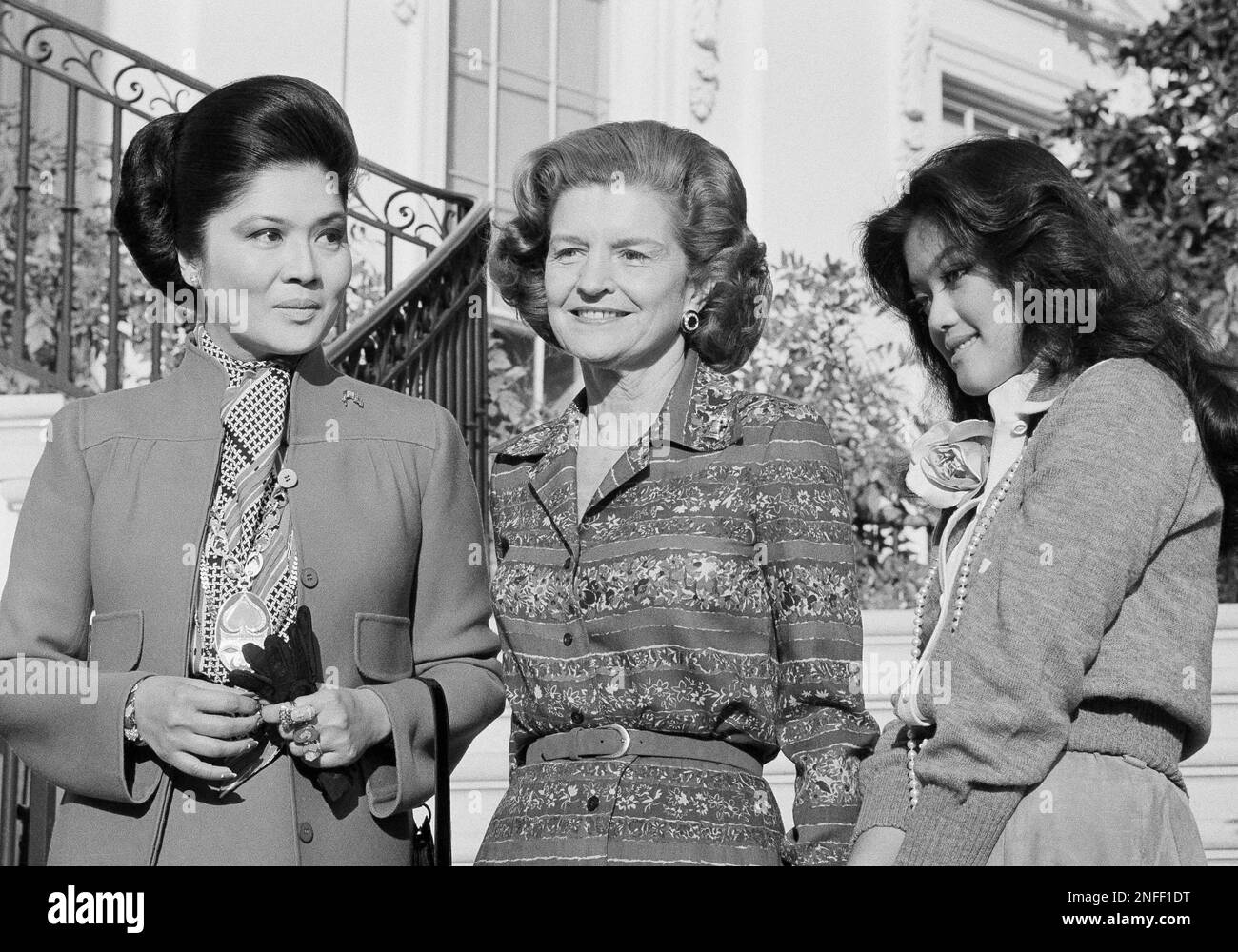 First lady Betty Ford, center, greets Mrs. Imelda Marcos, left, wife of ...