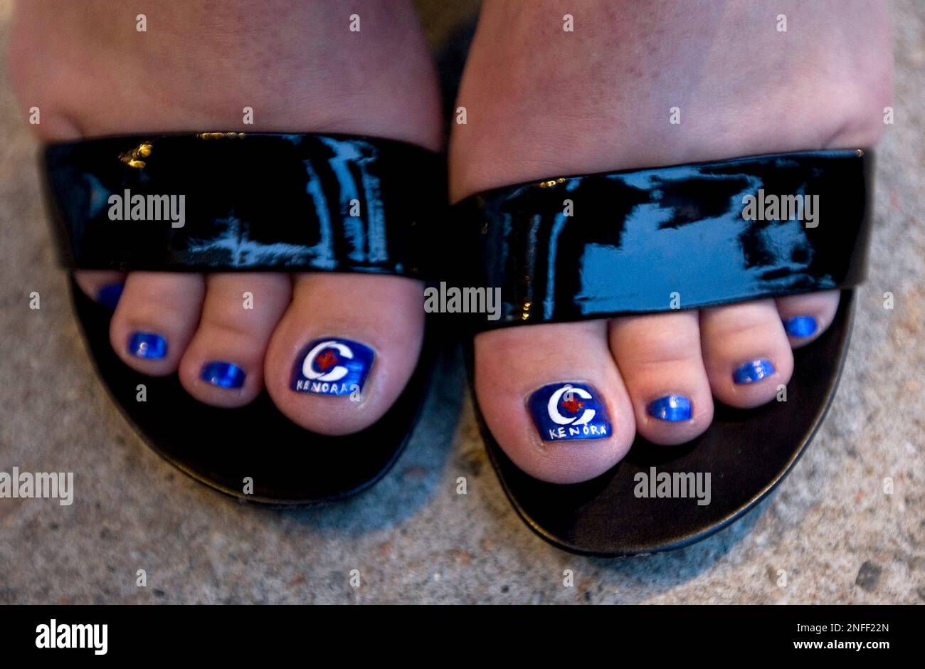 Anne Ayotte shows off her toe nails painted with the Conservative logo ...