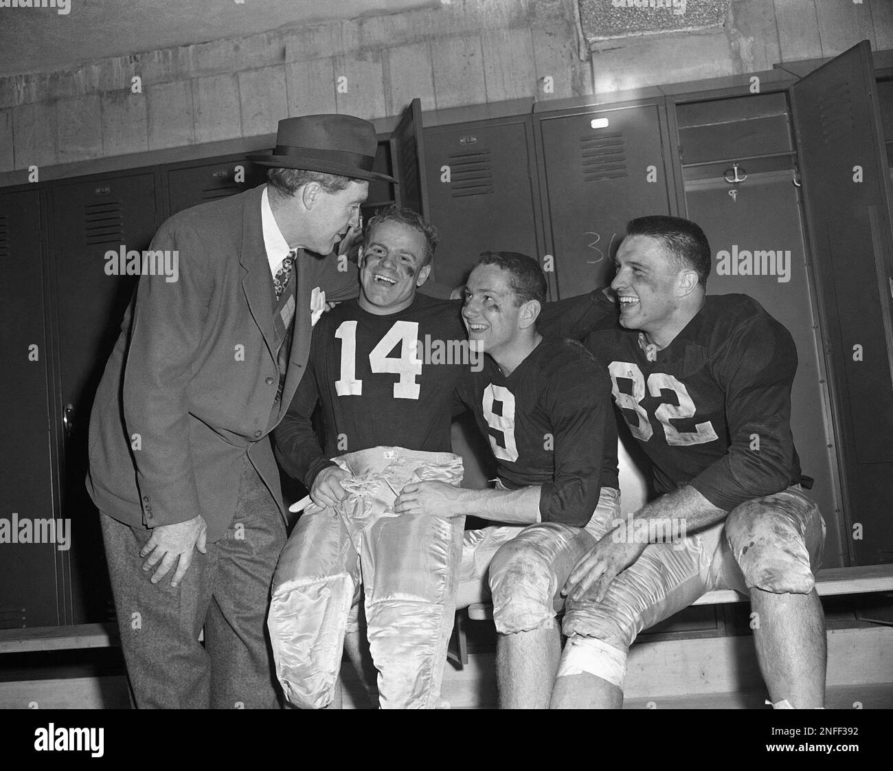 Coach Frank Leahy of Notre Dame, left, congratulates his key players ...