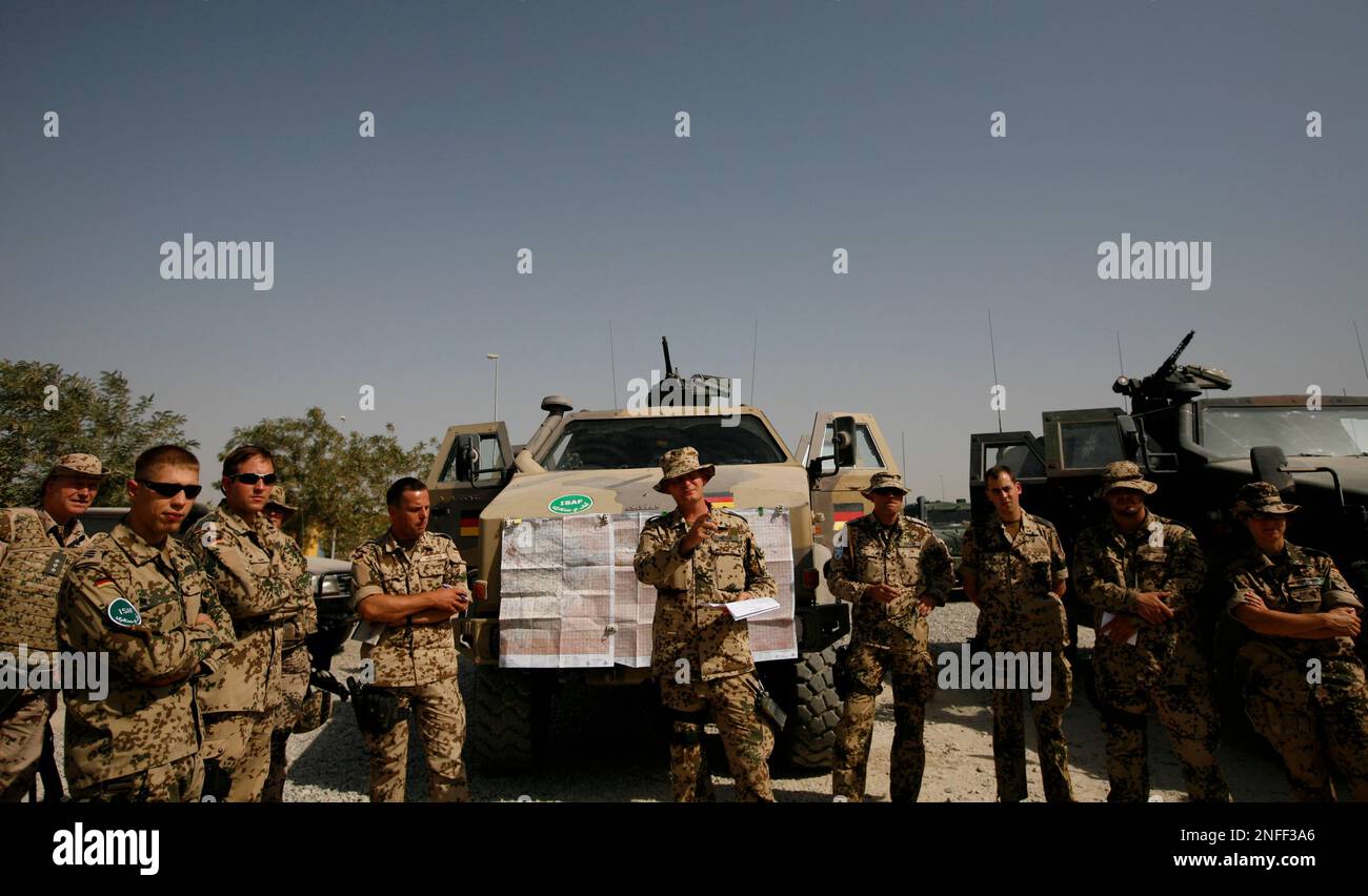 ISAF soldiers of the German Federal Armed Forces (Bundeswehr) get a ...