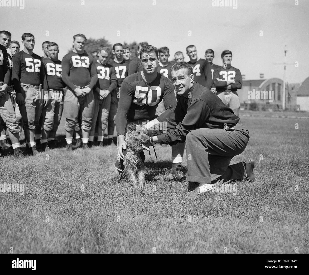 Notre Dame coach Frank Leahy, front right, and Capt. Jerry Groom (50 ...