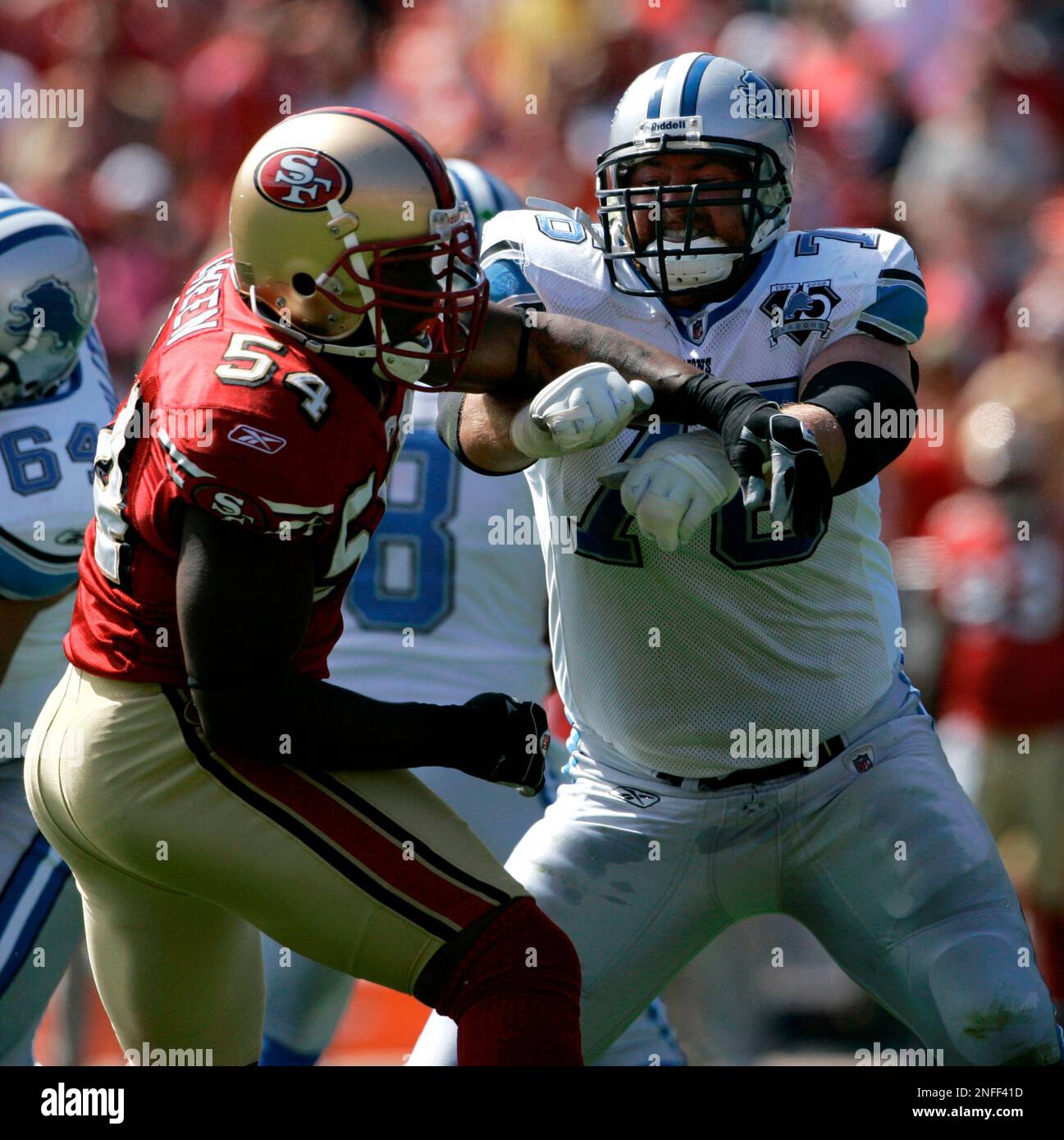 Detroit Lions' Jeff Backus, right, guards against San Francisco 49ers ...