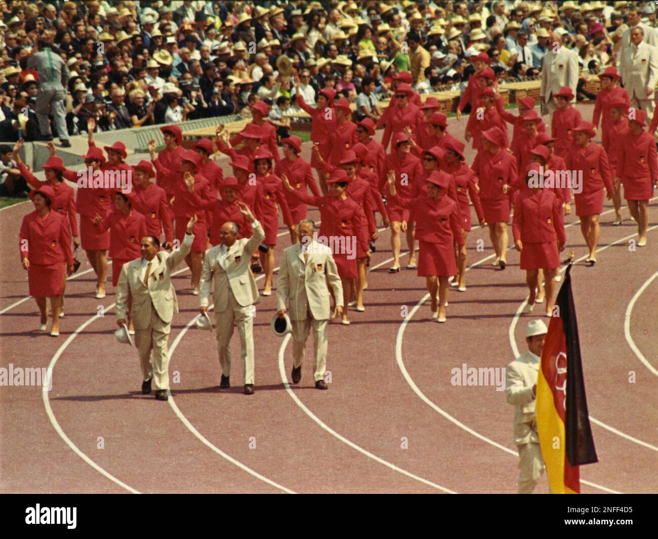West German olympic team, the women in red dresses and the men in fair ...