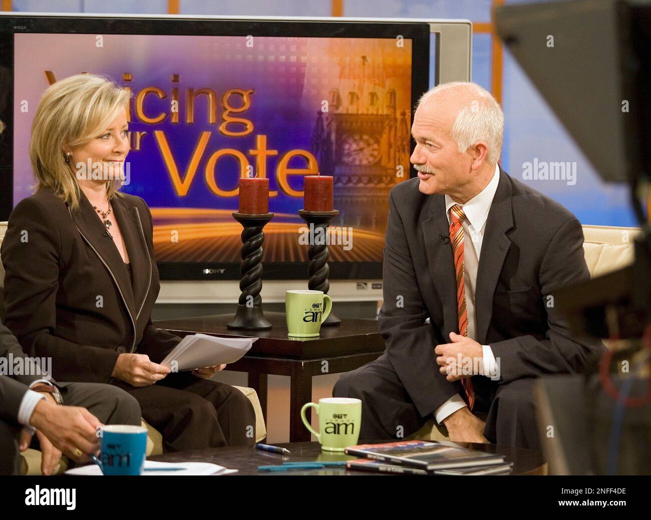 NDP Leader Jack Layton, right, responds to Belverly Thomson during an ...