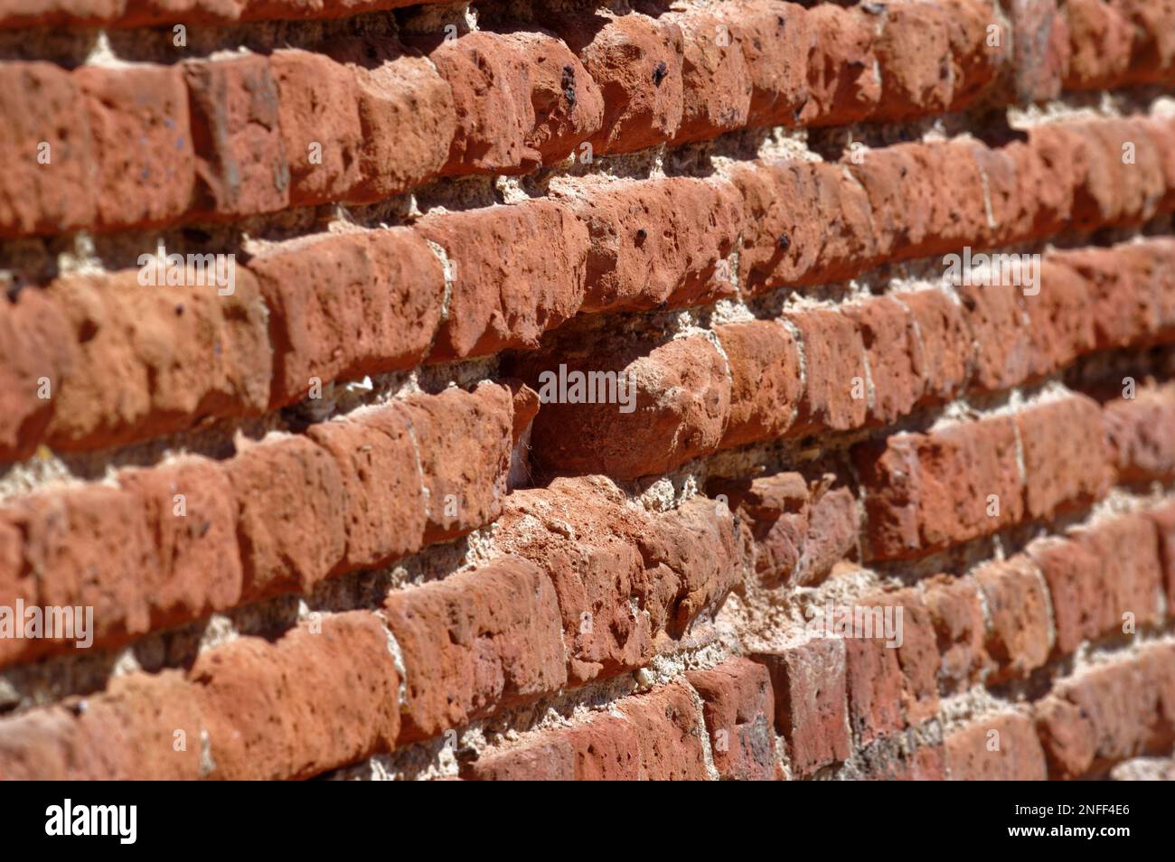 Old, English bond laid brick wall in poor, eroded condition Stock Photo ...