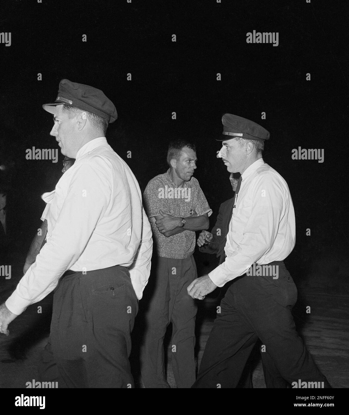 Capt. Frank Riley left and Co-Capt. J. T. Richardson walks towards ...