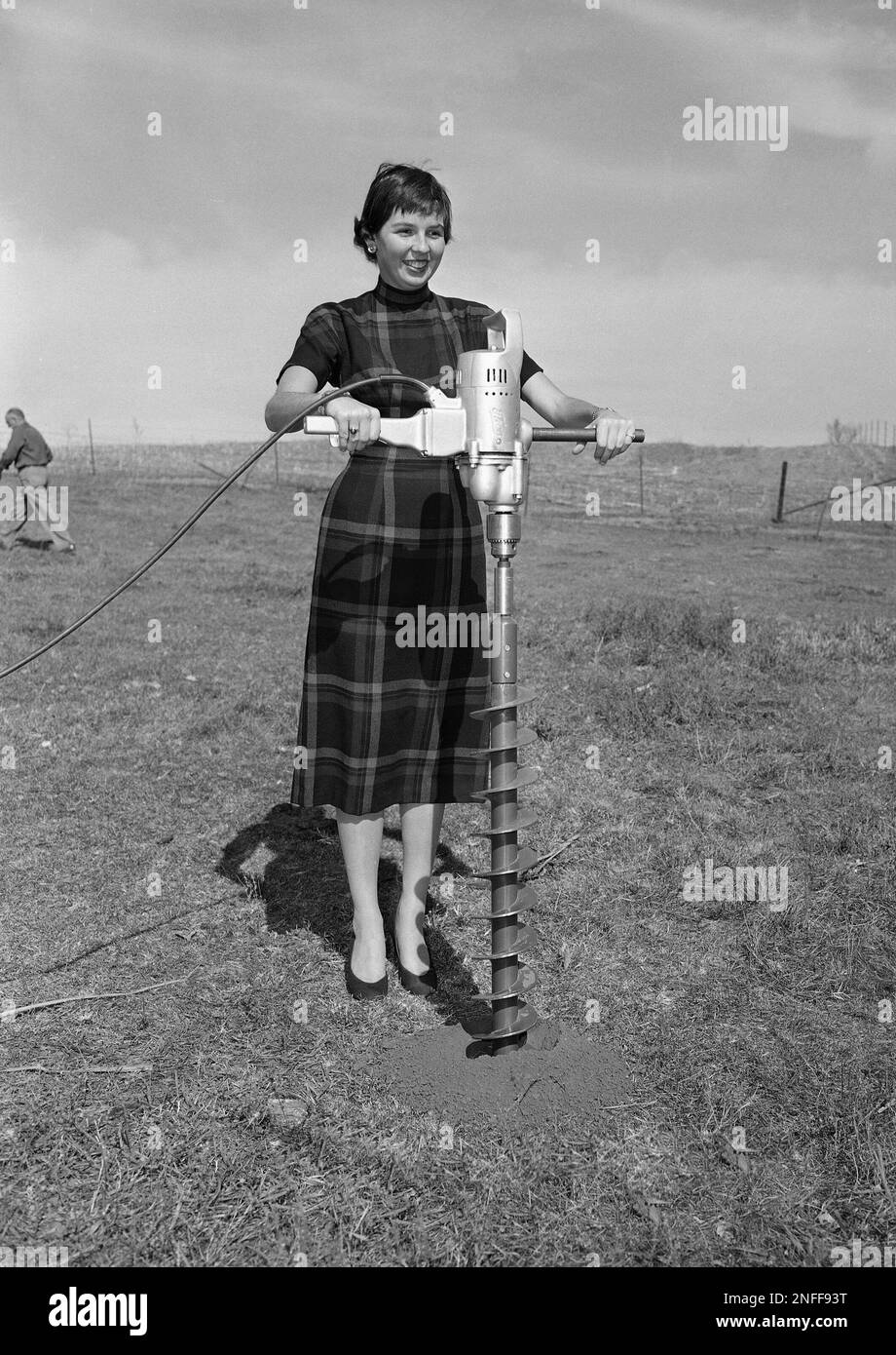 Honey Hurley demonstrates a new electric powered earth auger developed ...
