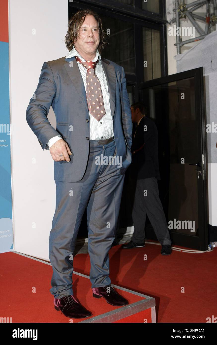 Actor Mickey Rourke poses in the press room after the film in which he ...