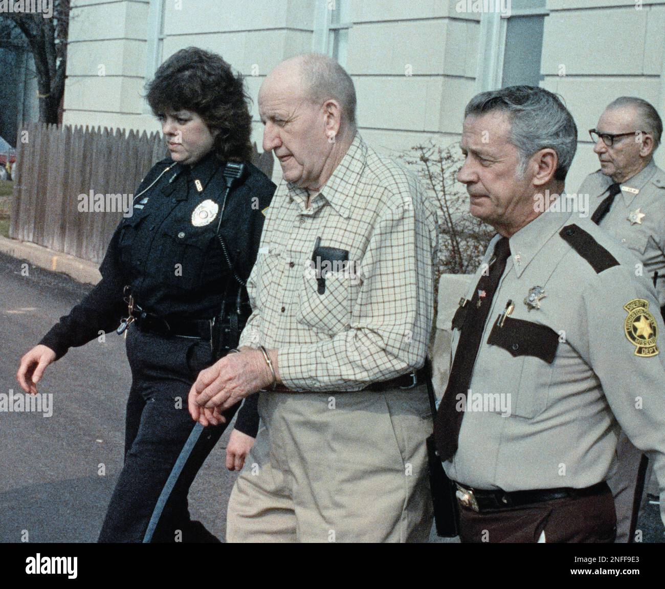 Ray Copeland, center, is led in handcuffs from the Livingston County ...