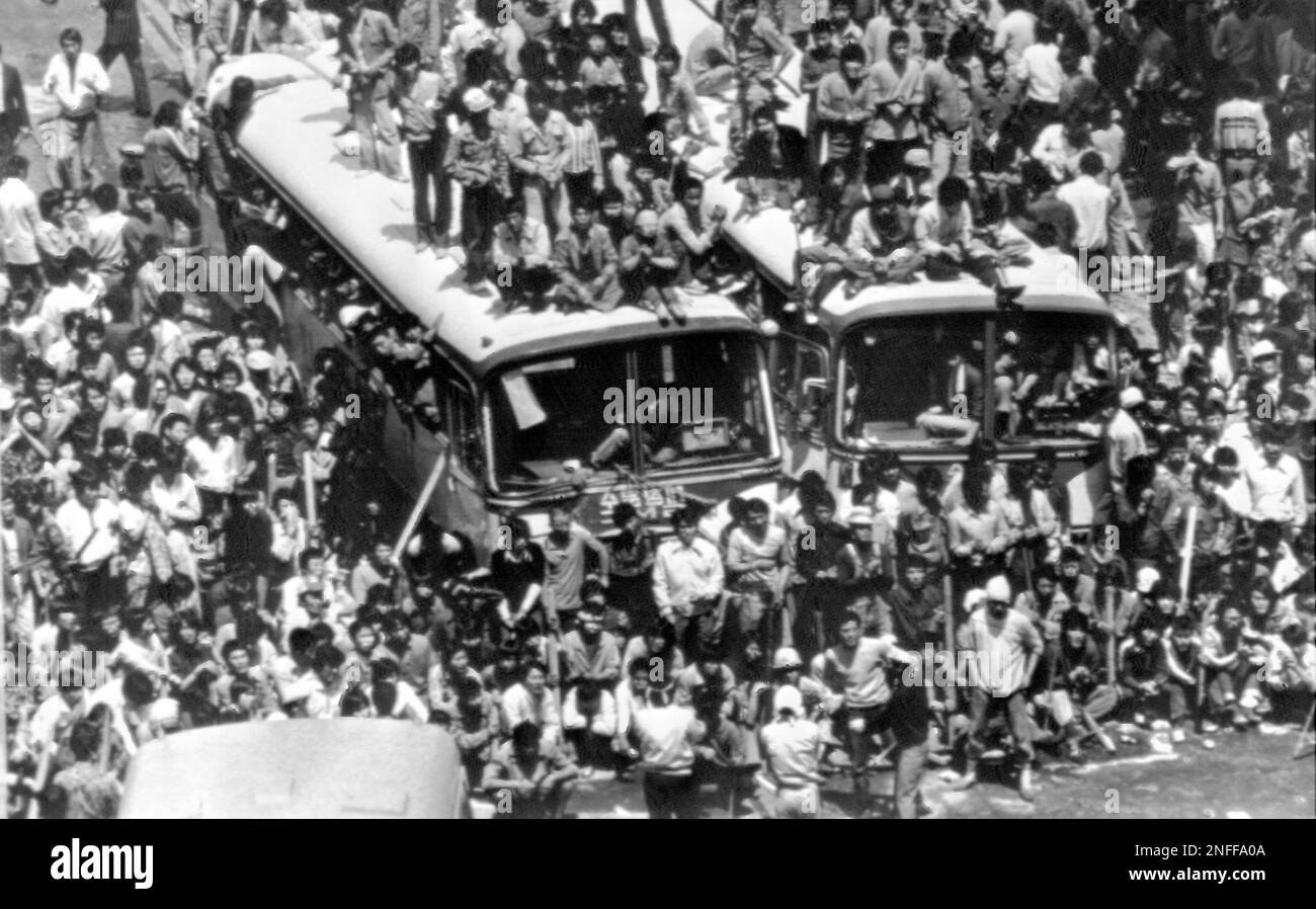 Commandeered city buses are used to block a main downtown street of ...