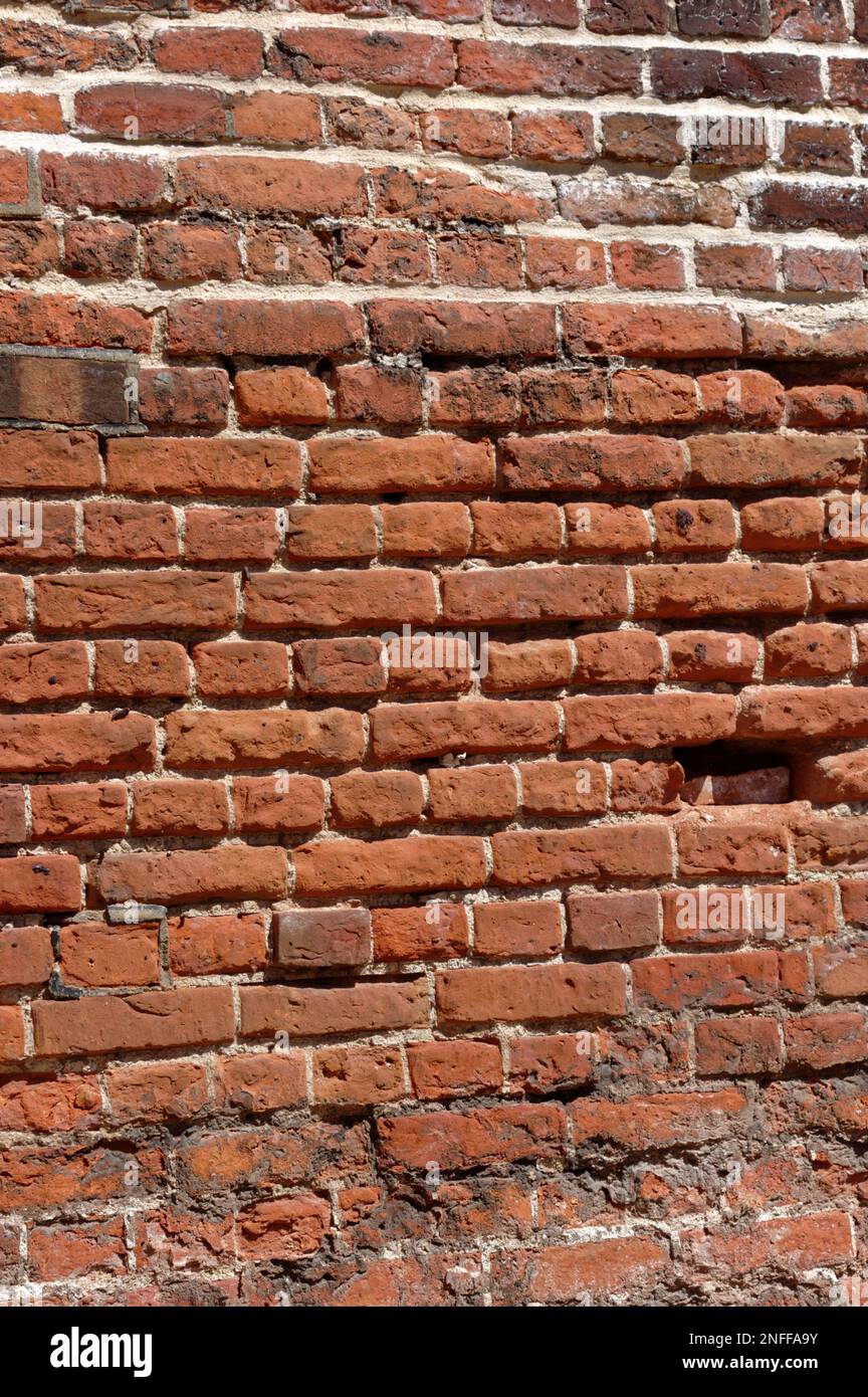 Old, English bond laid brick wall in poor, eroded condition Stock Photo ...