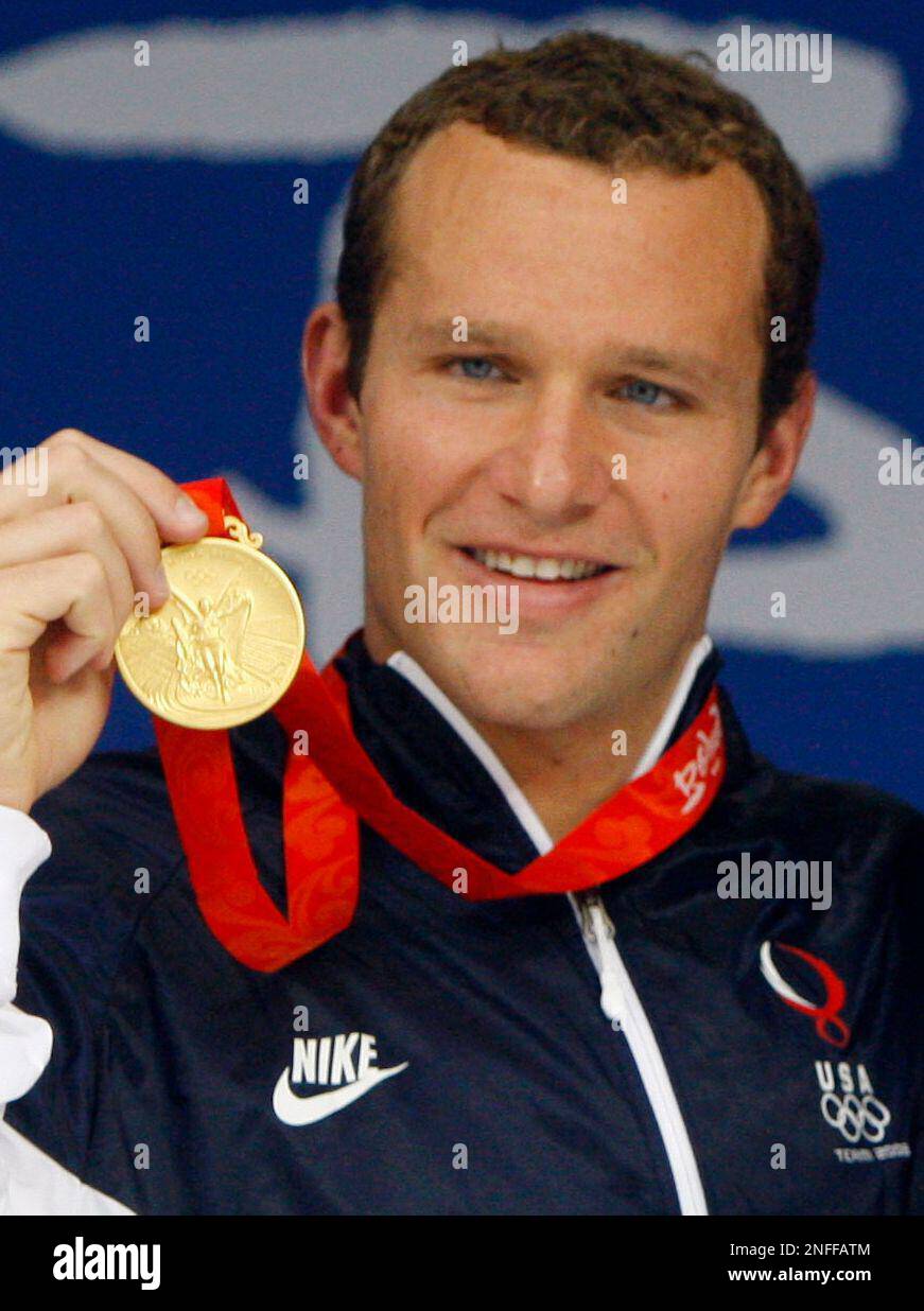 ** FILE ** U.S. swimmer Brendan Hansen shows off his gold medal during ...