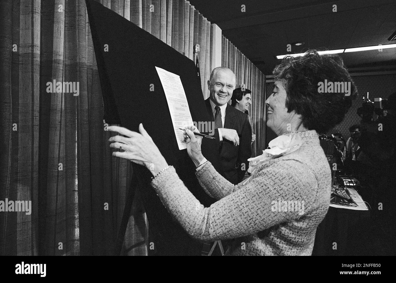 Mrs. Anna Glenn, signs a declaration of candidacy petition for husband ...