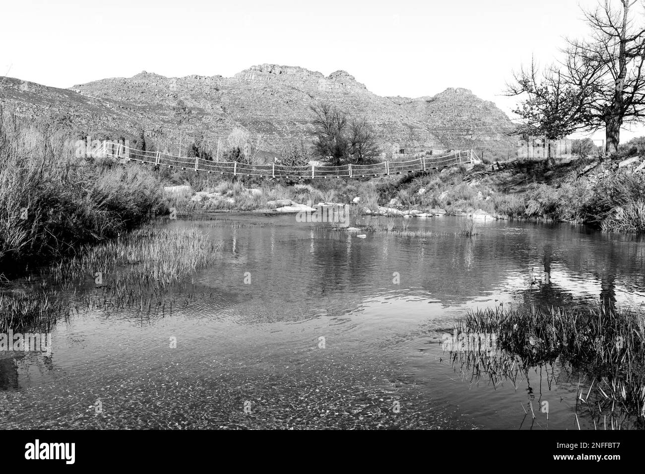 View of the pedestrian bridge over the Krom River at Kromrivier ...