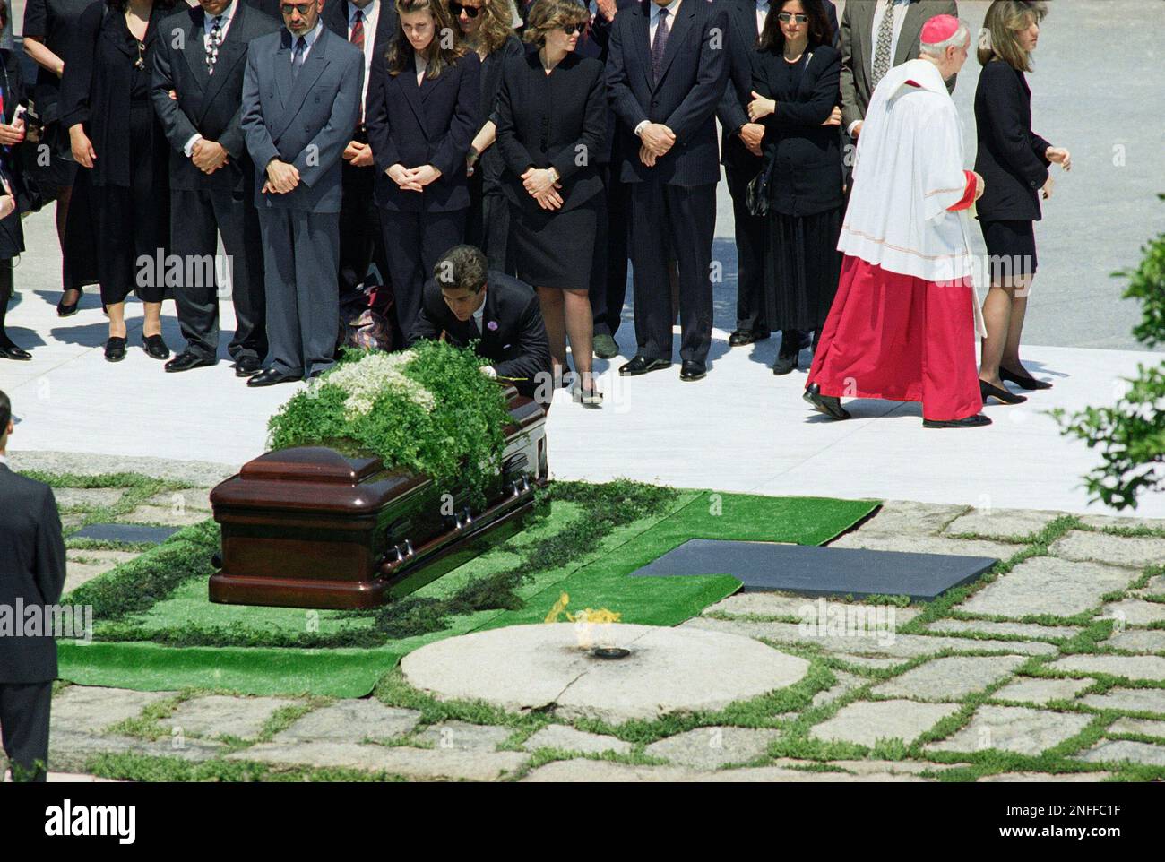 John Kennedy Jr. kneels at the coffin of his mother, Jacqueline Kennedy ...