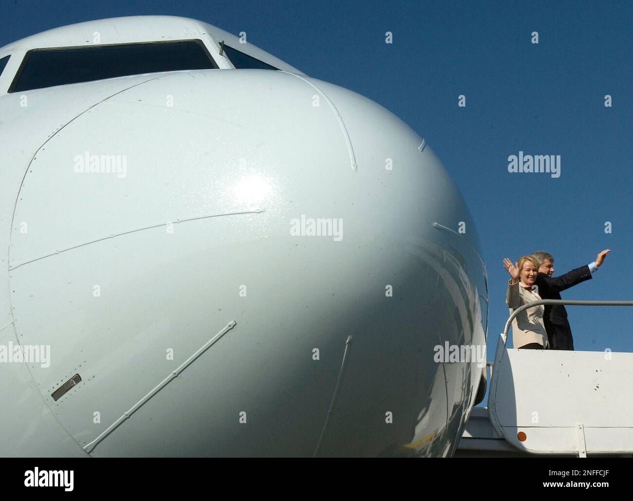 Conservative party leader Stephen Harper and his wife Laureen wave upon ...